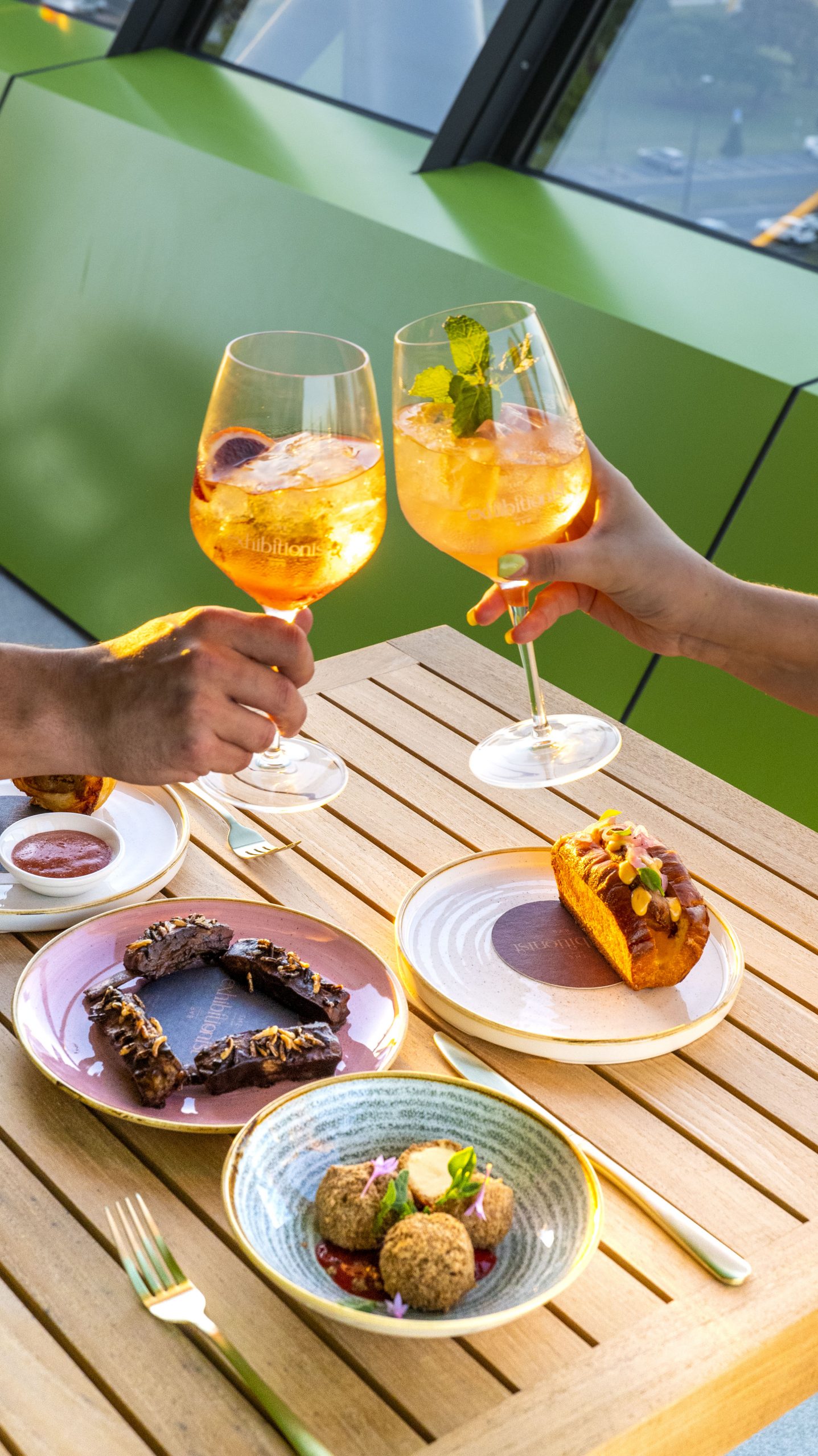 About - The Exhibitionist Bar