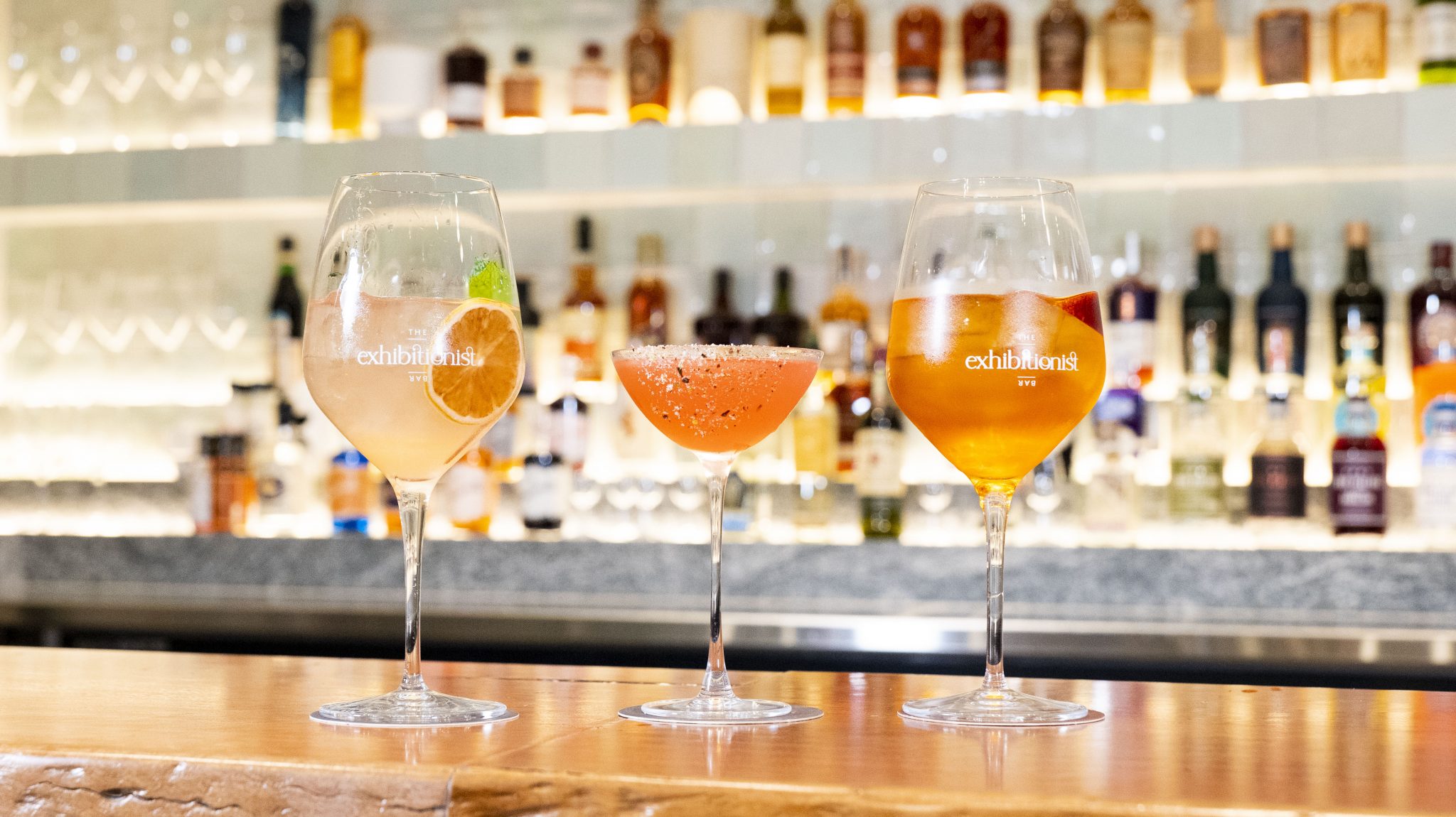 About - The Exhibitionist Bar